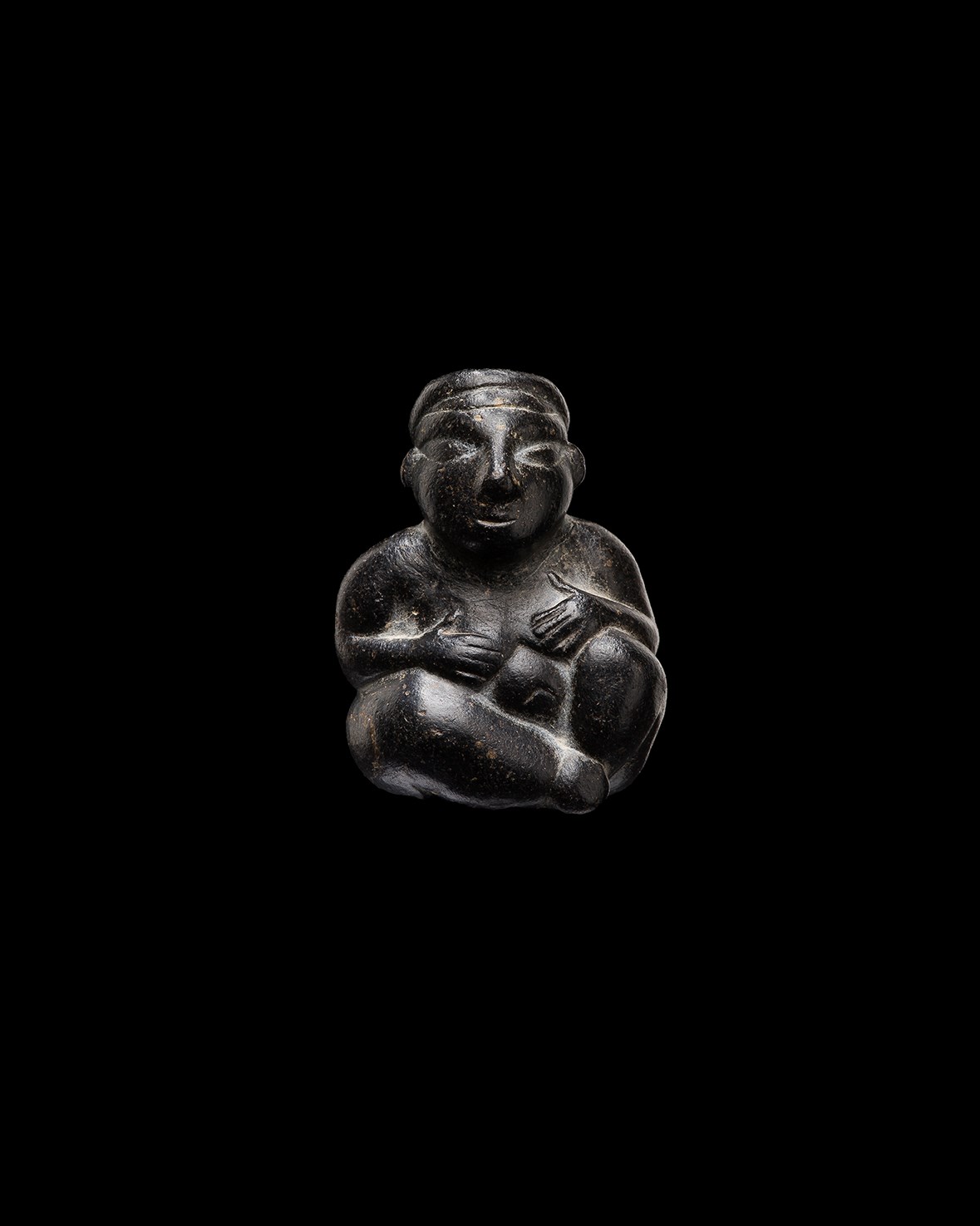 Steatopygous feminine idol sitting cross-legged | MasterArt