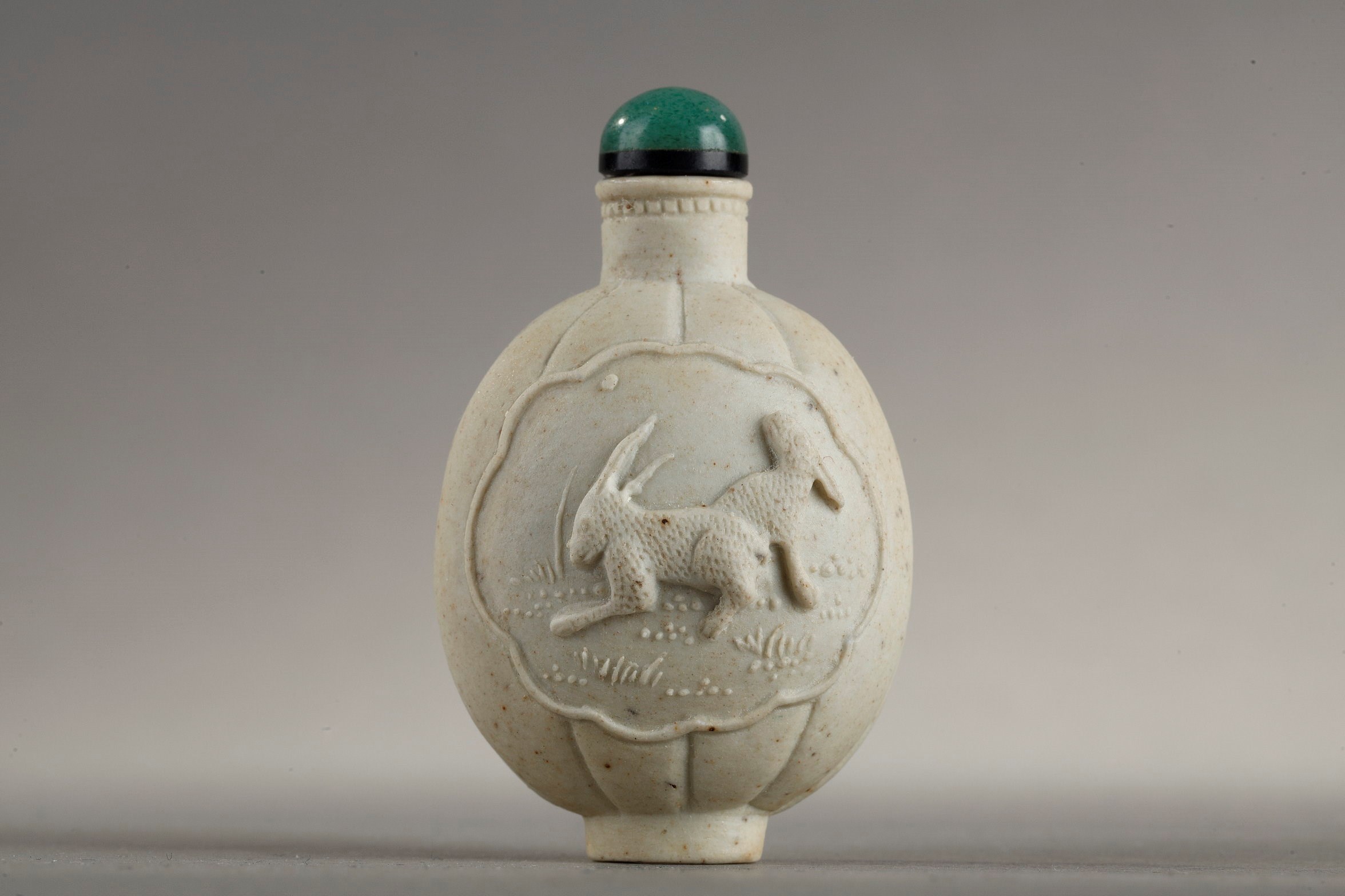 small biscuit snuff bottle (porcelain) with rabbit relief decoration on ...