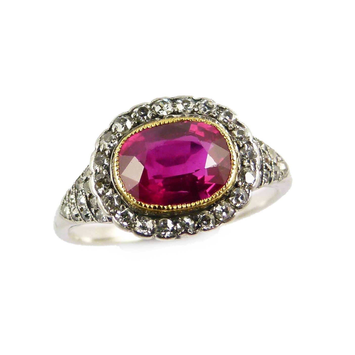Antique cushion cut ruby and diamond cluster ring, c.1905, set with a 2 ...